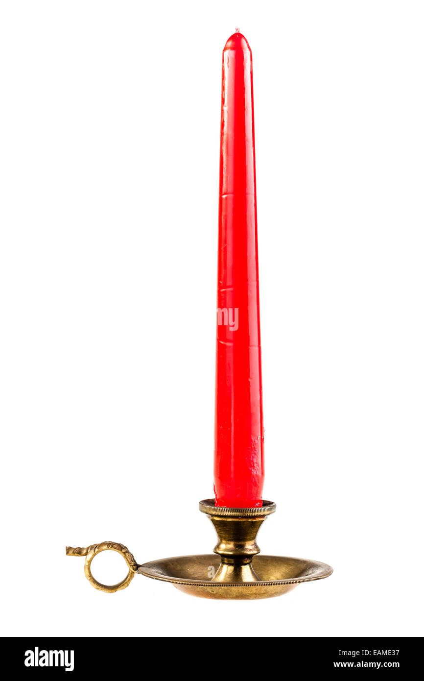 Retro antique candlestick with red candle isolated over a white ...