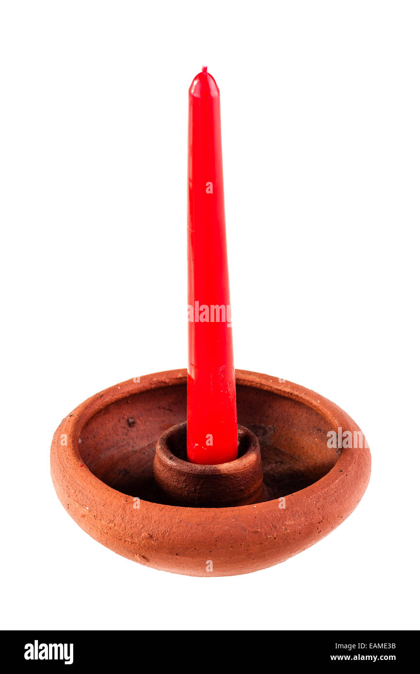 Retro antique candlestick with red candle isolated over a white ...