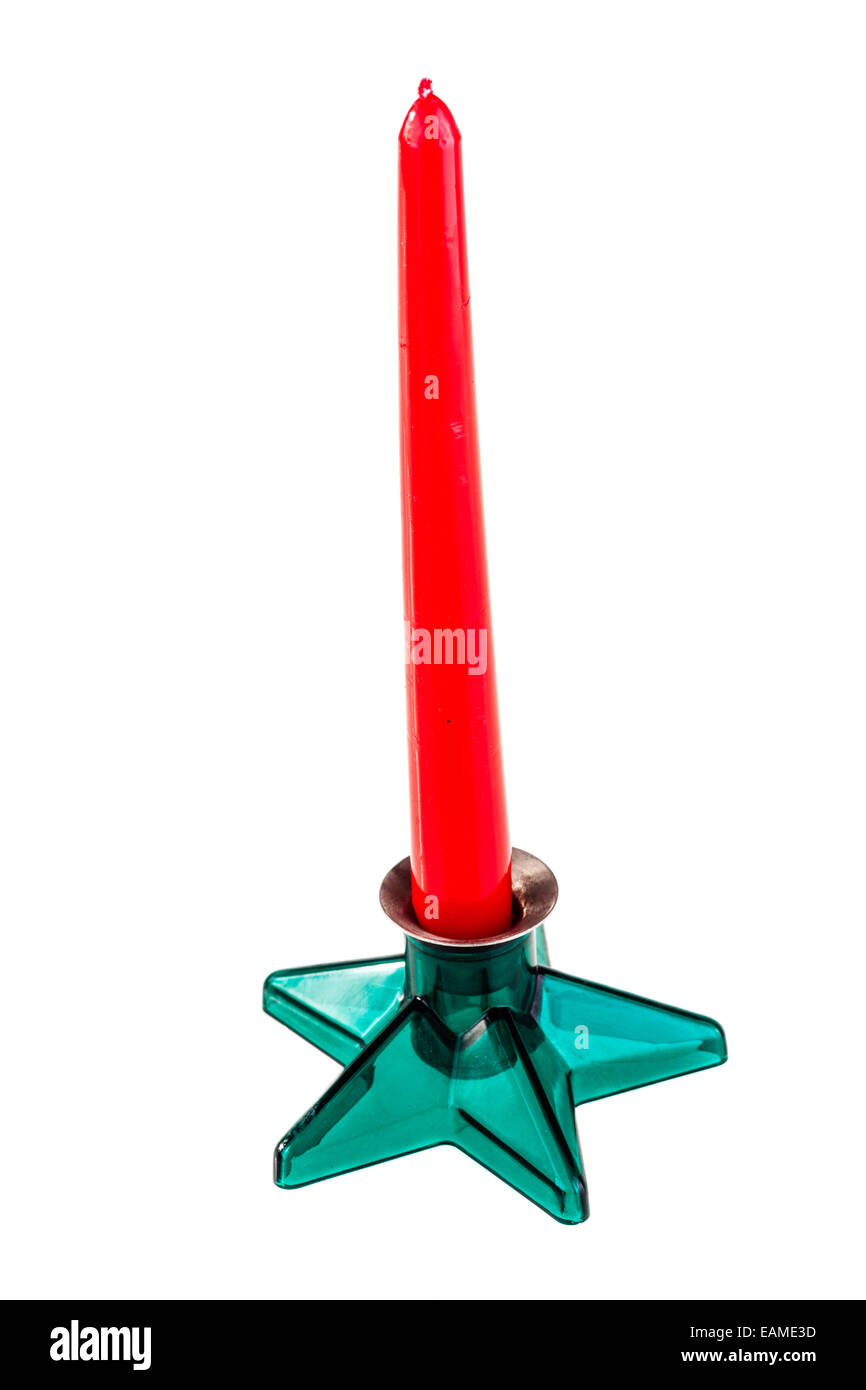 Retro antique candlestick with red candle isolated over a white ...