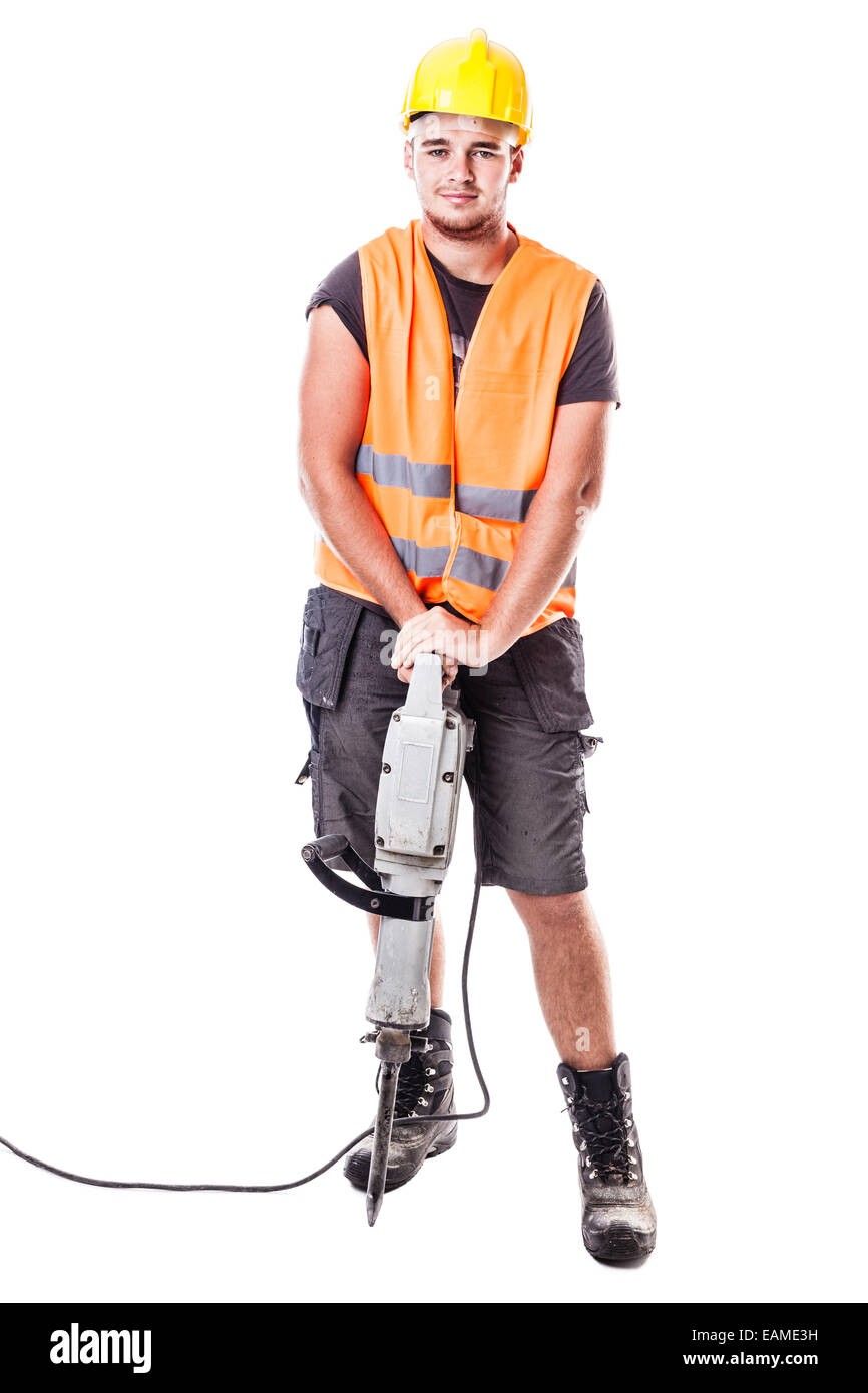 a young road worker wearing a hardhat and a visibility vest holding a ...