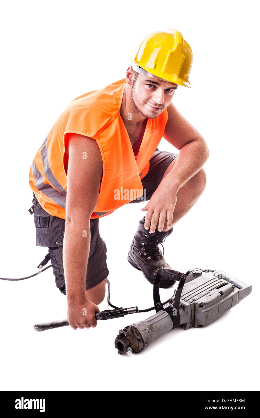 a young road worker wearing a hardhat and a visibility vest holding a ...