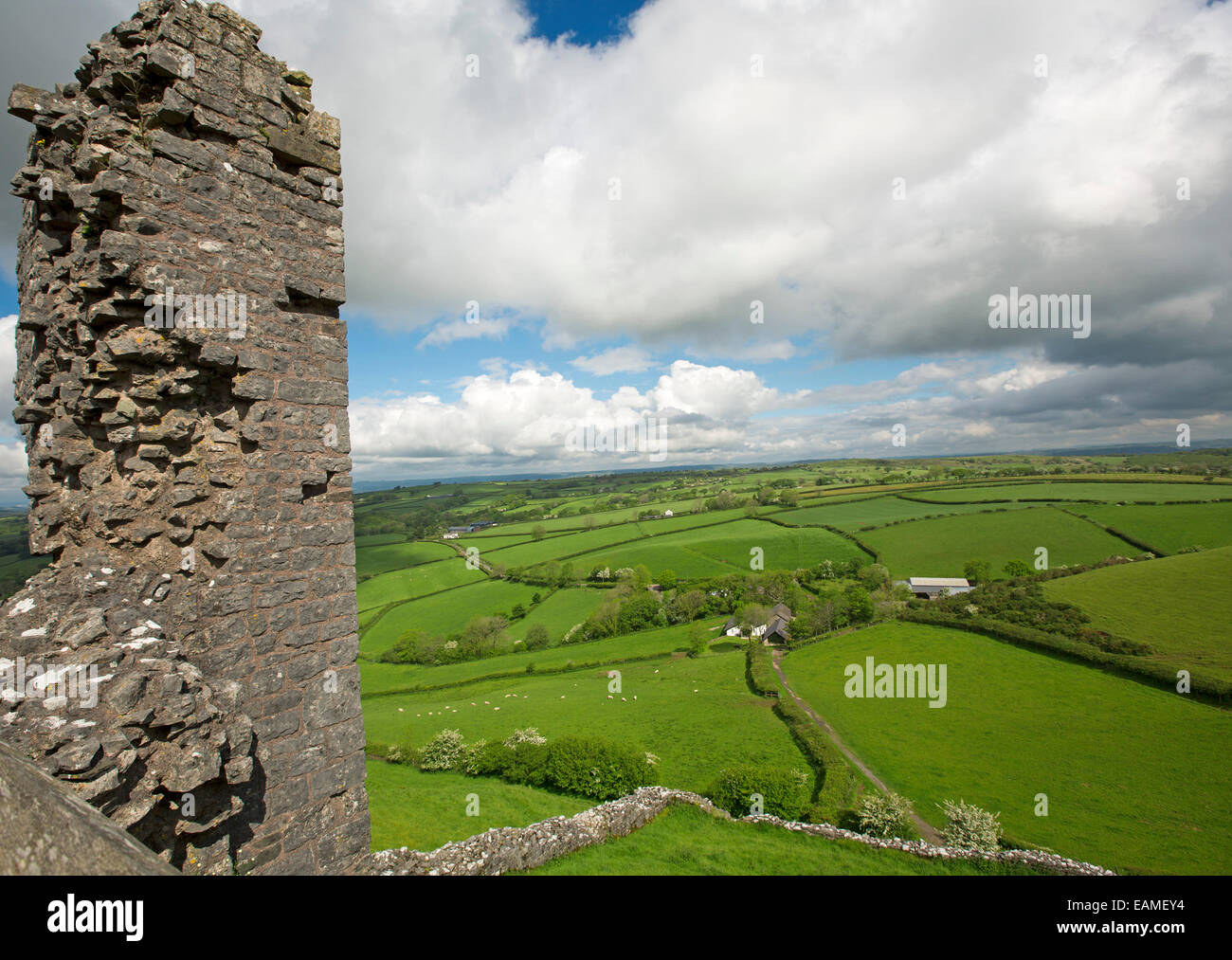 Spectacular view of vast emerald farmlands on rolling hills under blue ...