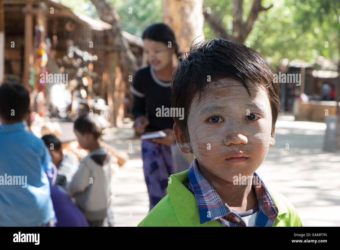 Family,boy,mother with thanaka bark cream face paint for cosmetic use ...