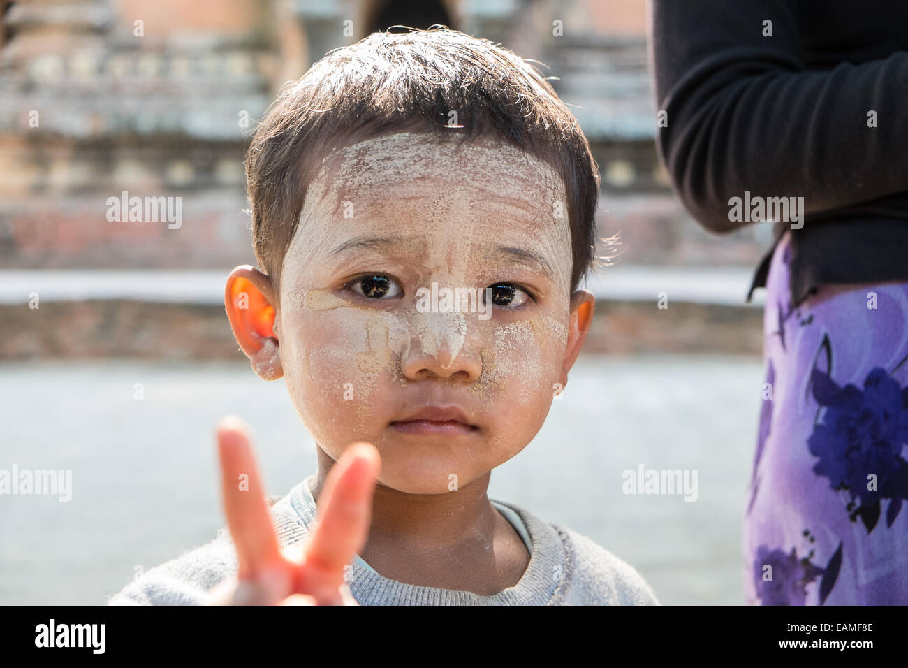 Family,boy,mother with thanaka bark cream face paint for cosmetic use ...