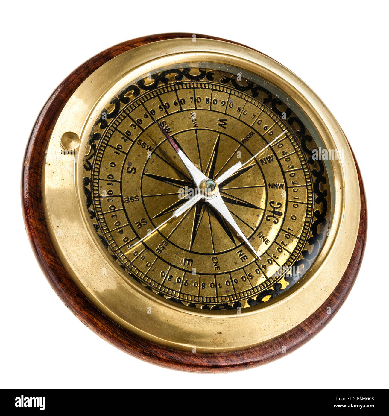 a vintage nautical table compass with golden parts and four needles ...