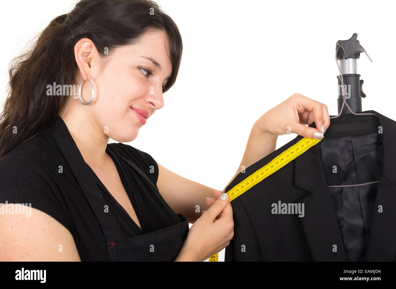 beautiful young woman tailor measuring a black suit Stock Photo - Alamy