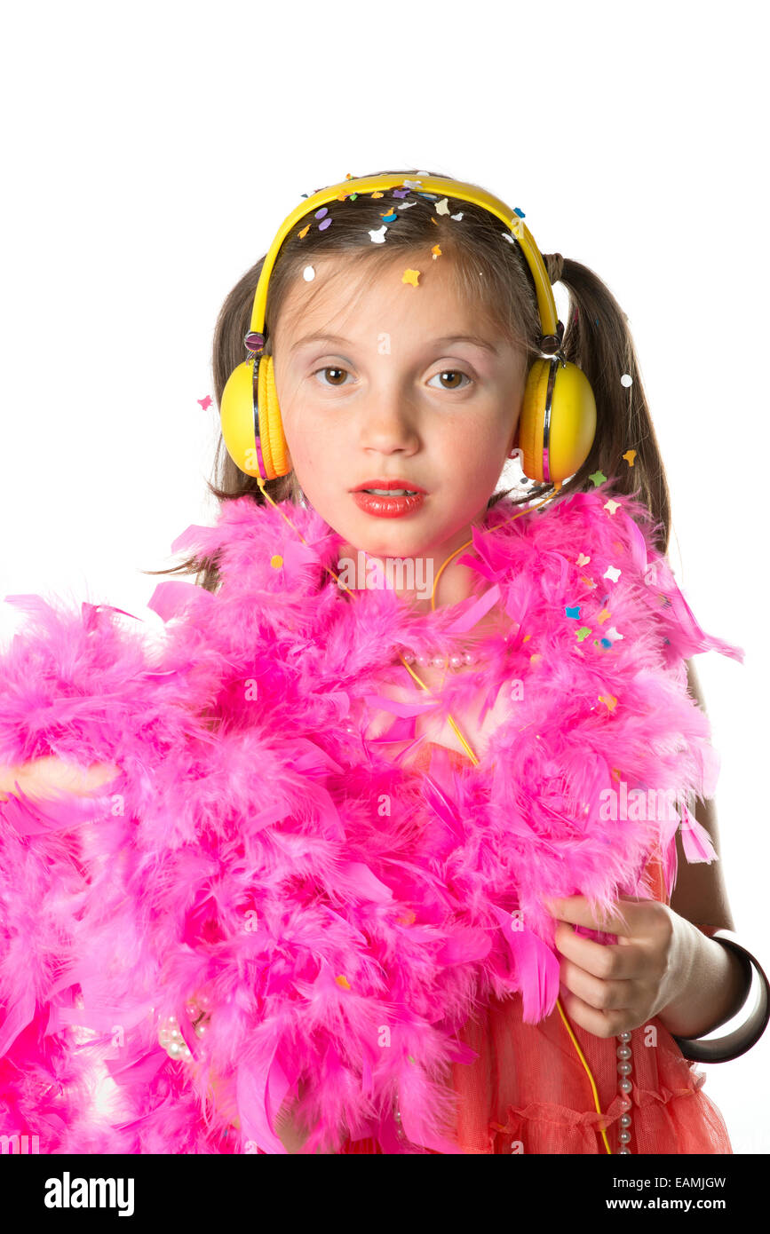 a pretty little girl with a pink feather boa on the white background ...