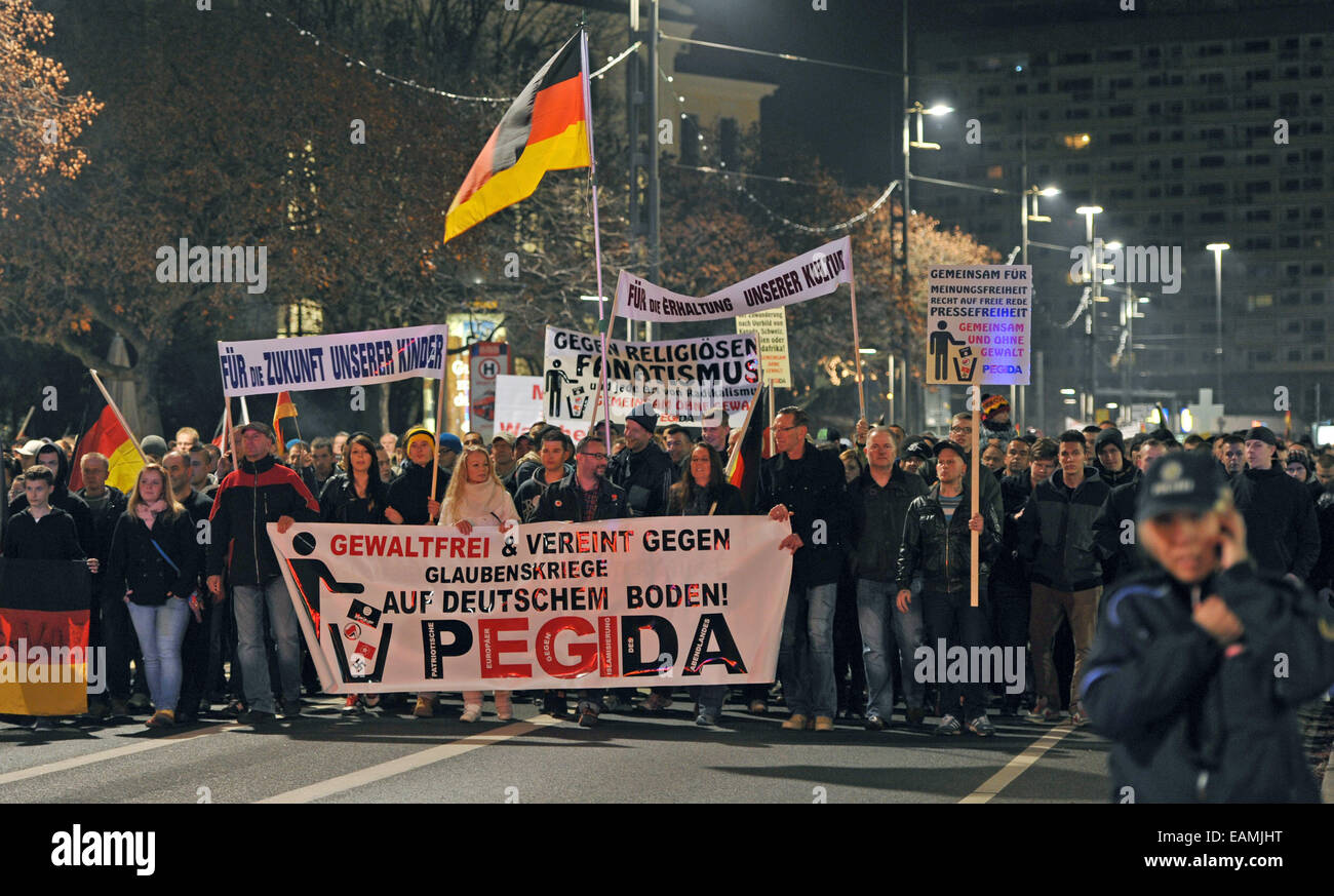 Dresden, Germany. 17th Nov, 2014. People march with a banner reading ...