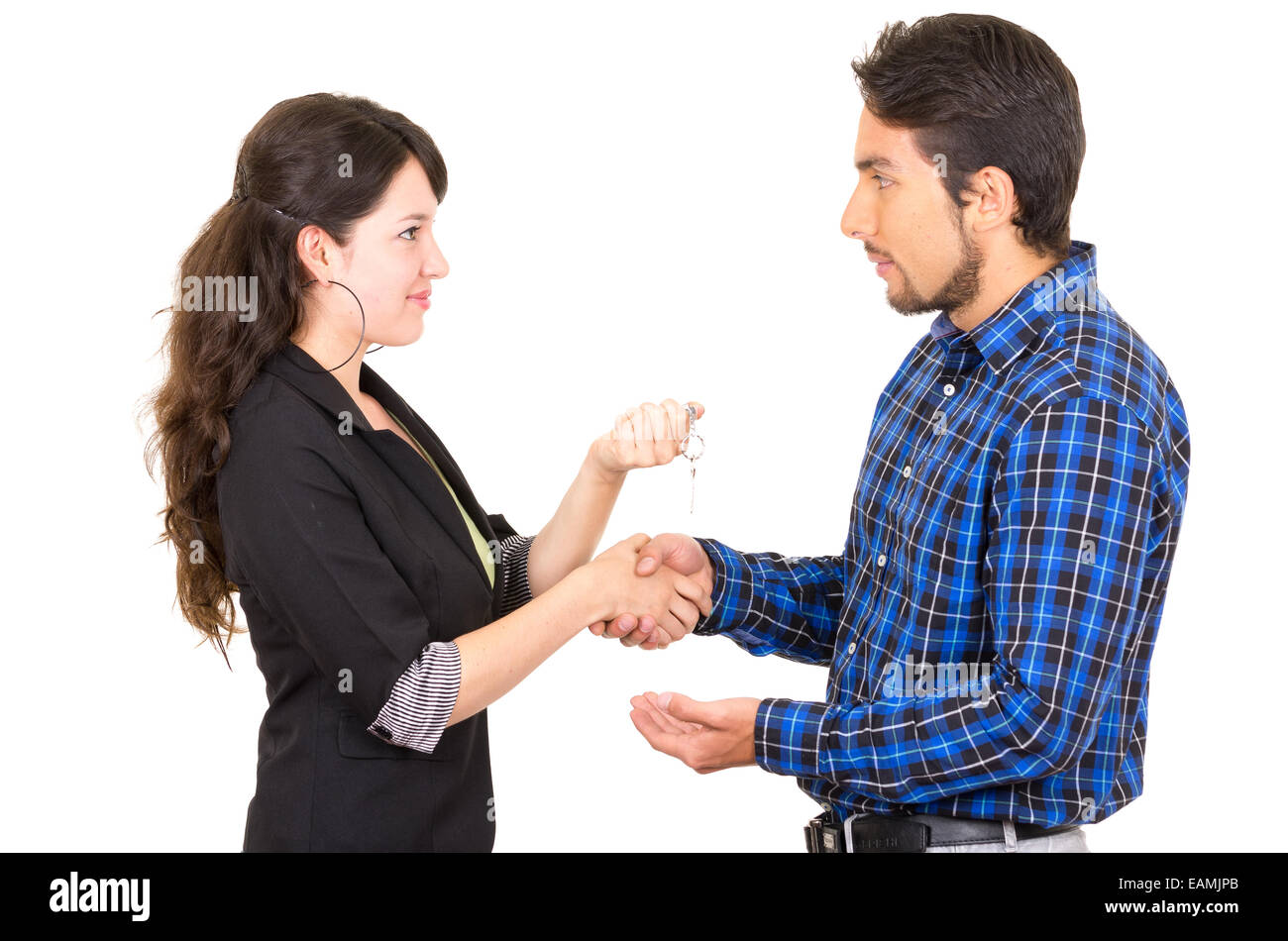 young beautiful woman handing over key to man Stock Photo - Alamy