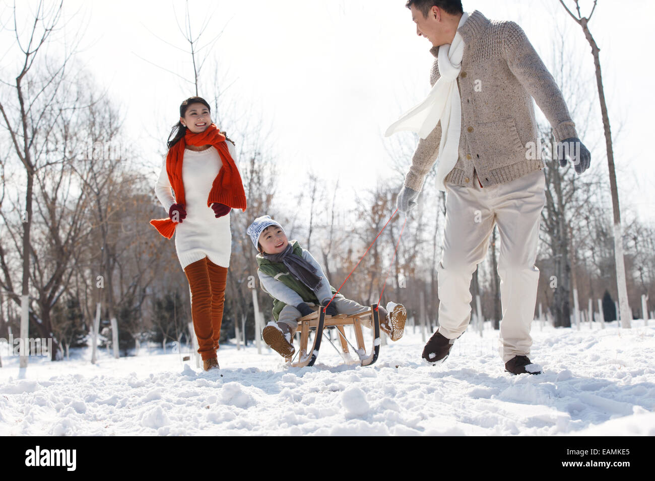 A family of three to play in the snow Stock Photo - Alamy