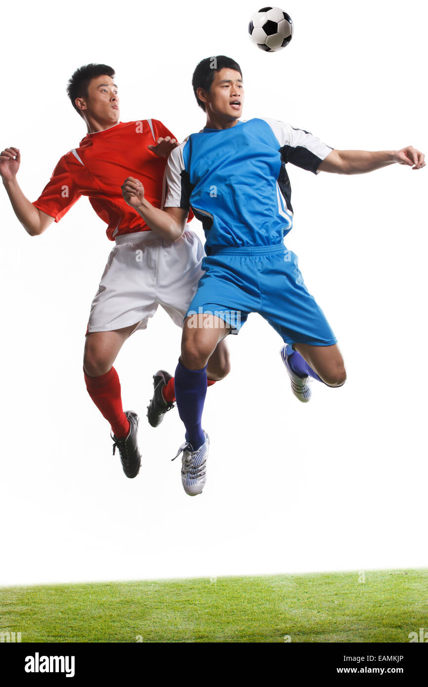 Two footballers to rob the ball Stock Photo - Alamy