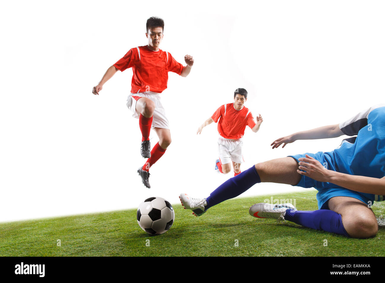 Three football players in football Stock Photo - Alamy
