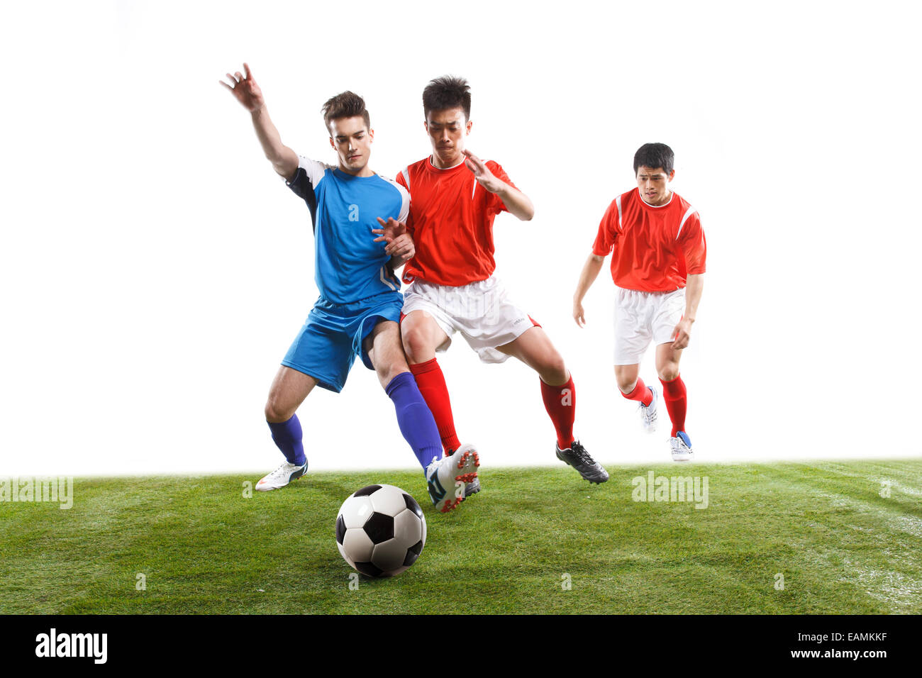 Three football players in football Stock Photo - Alamy