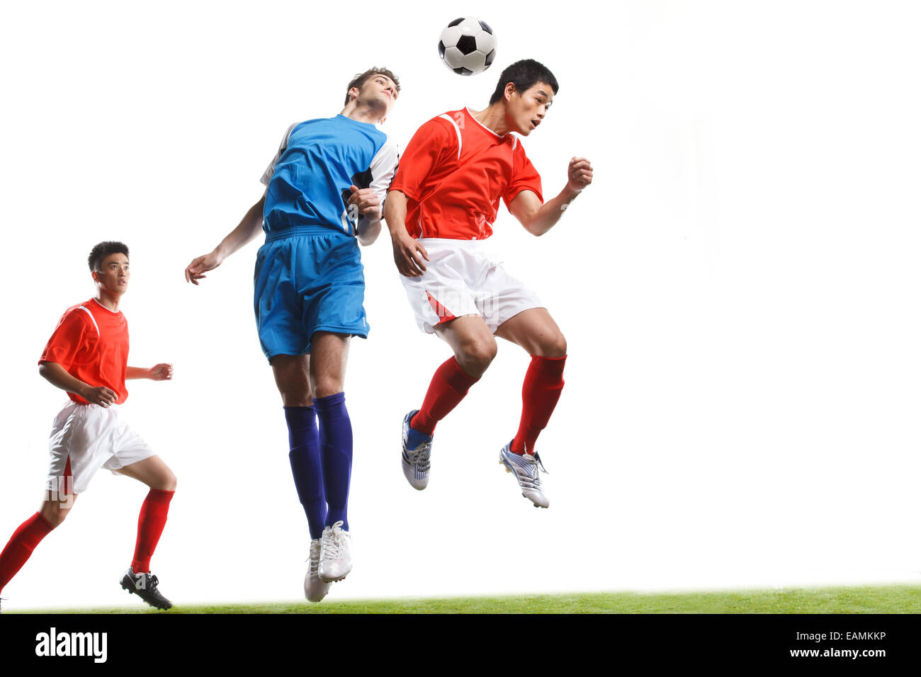 Three football players in football Stock Photo - Alamy