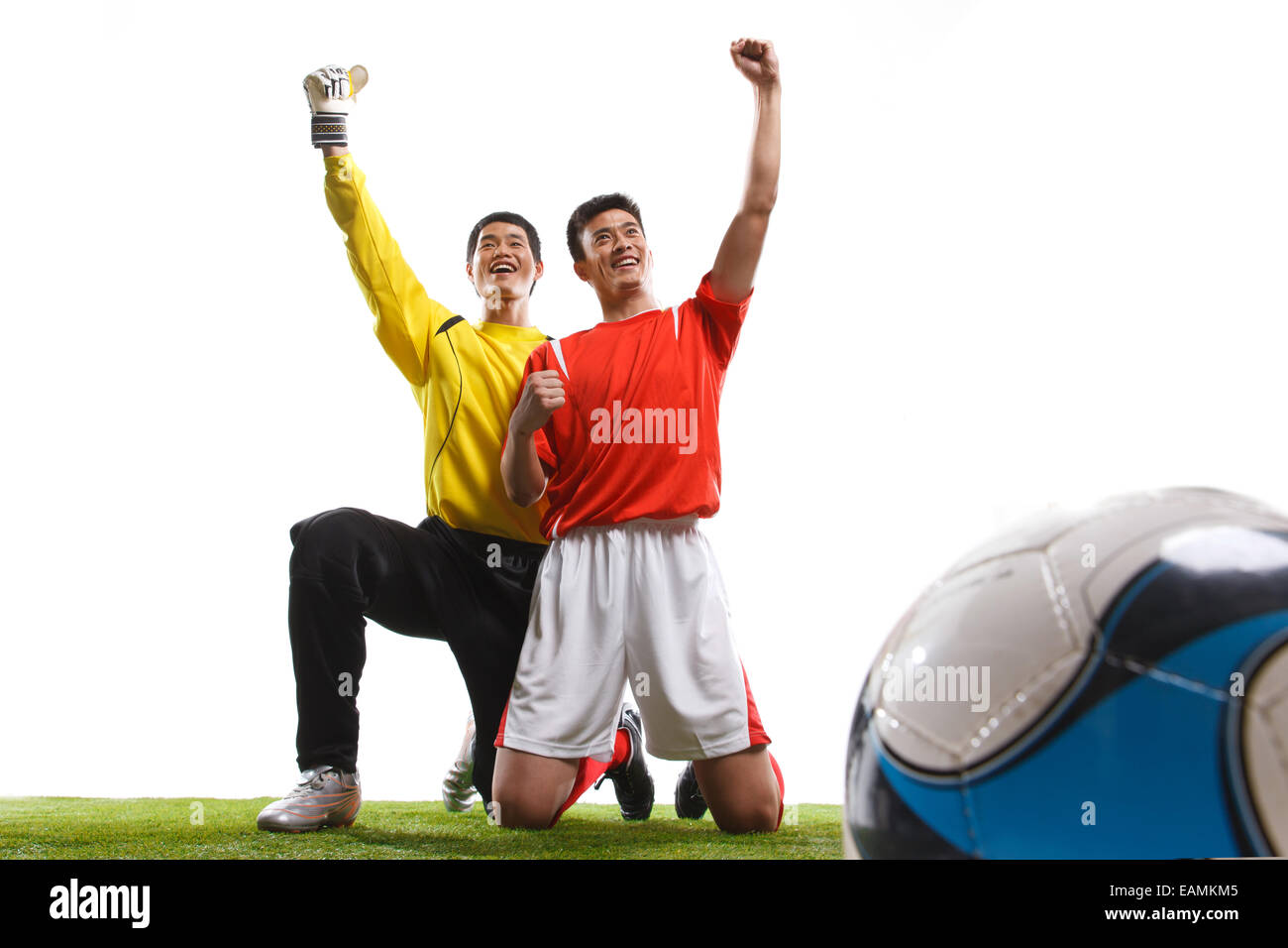 Football celebration kneeling hi-res stock photography and images - Alamy
