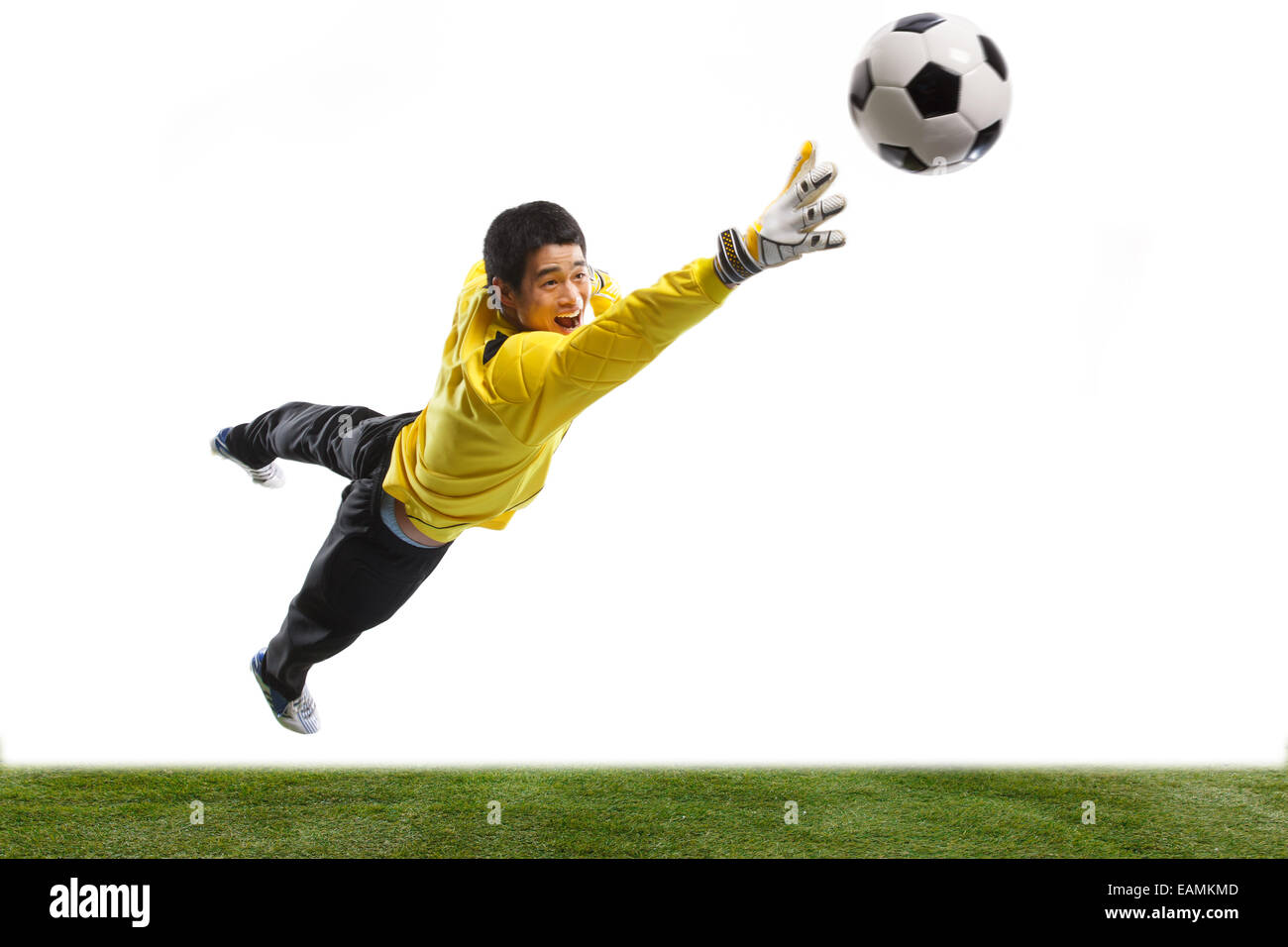 The goalkeeper to air to catch a ball Stock Photo - Alamy