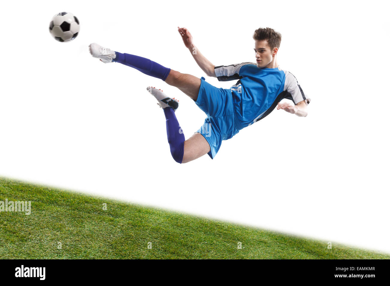 A football player is playing football Stock Photo - Alamy