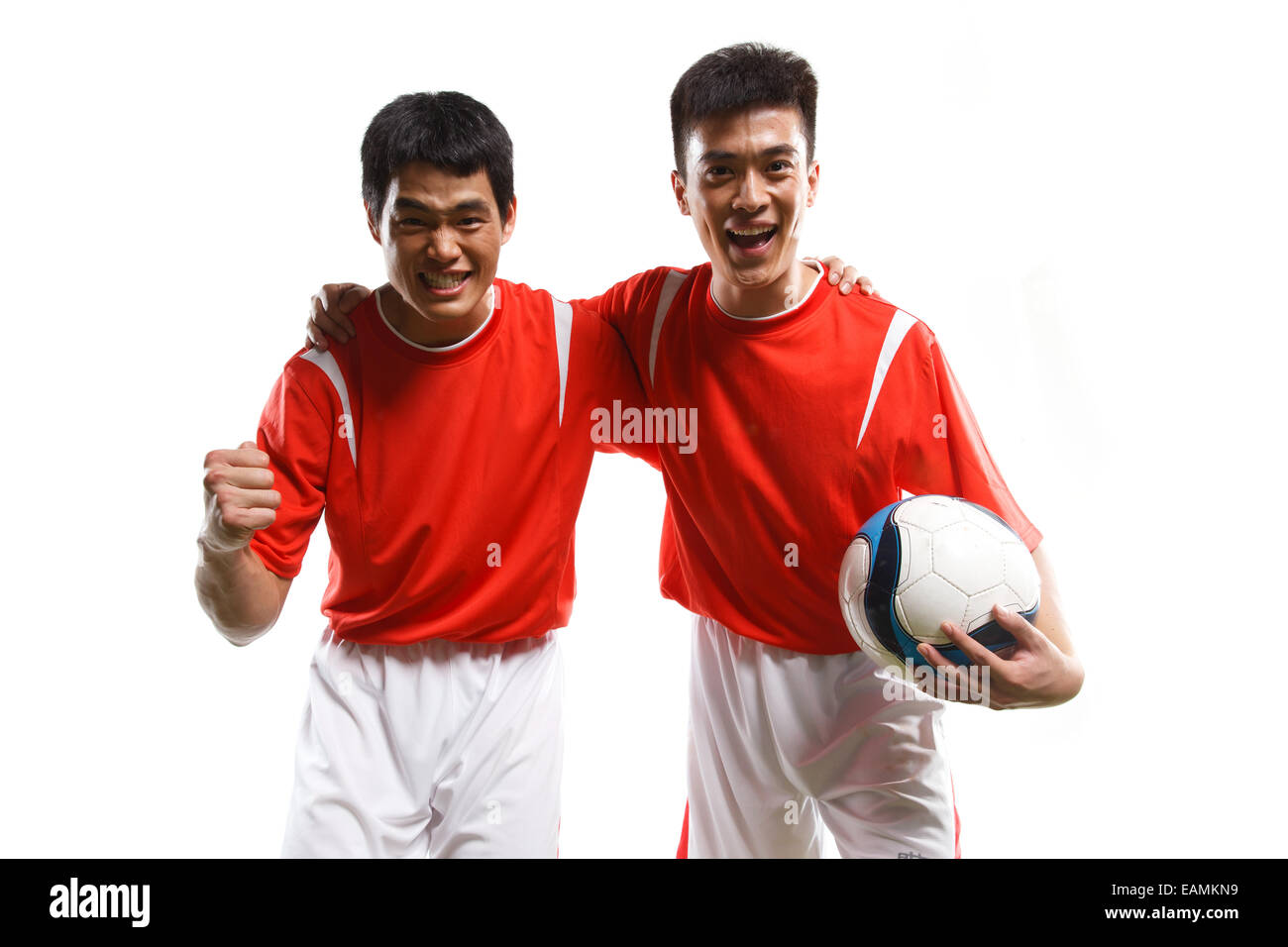 The two football players celebrate your success Stock Photo - Alamy