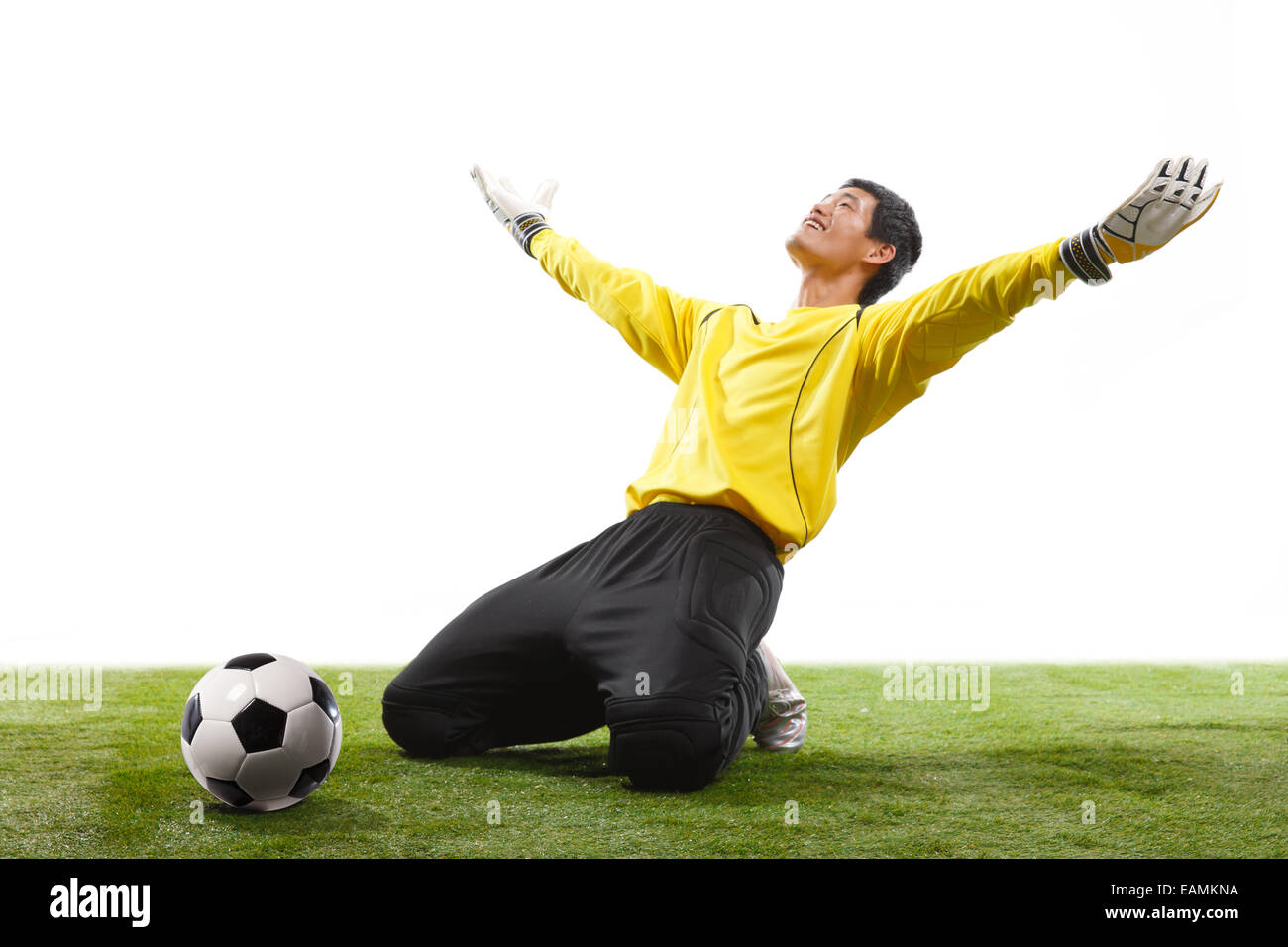Tread athletes kneeling on the ground Stock Photo - Alamy