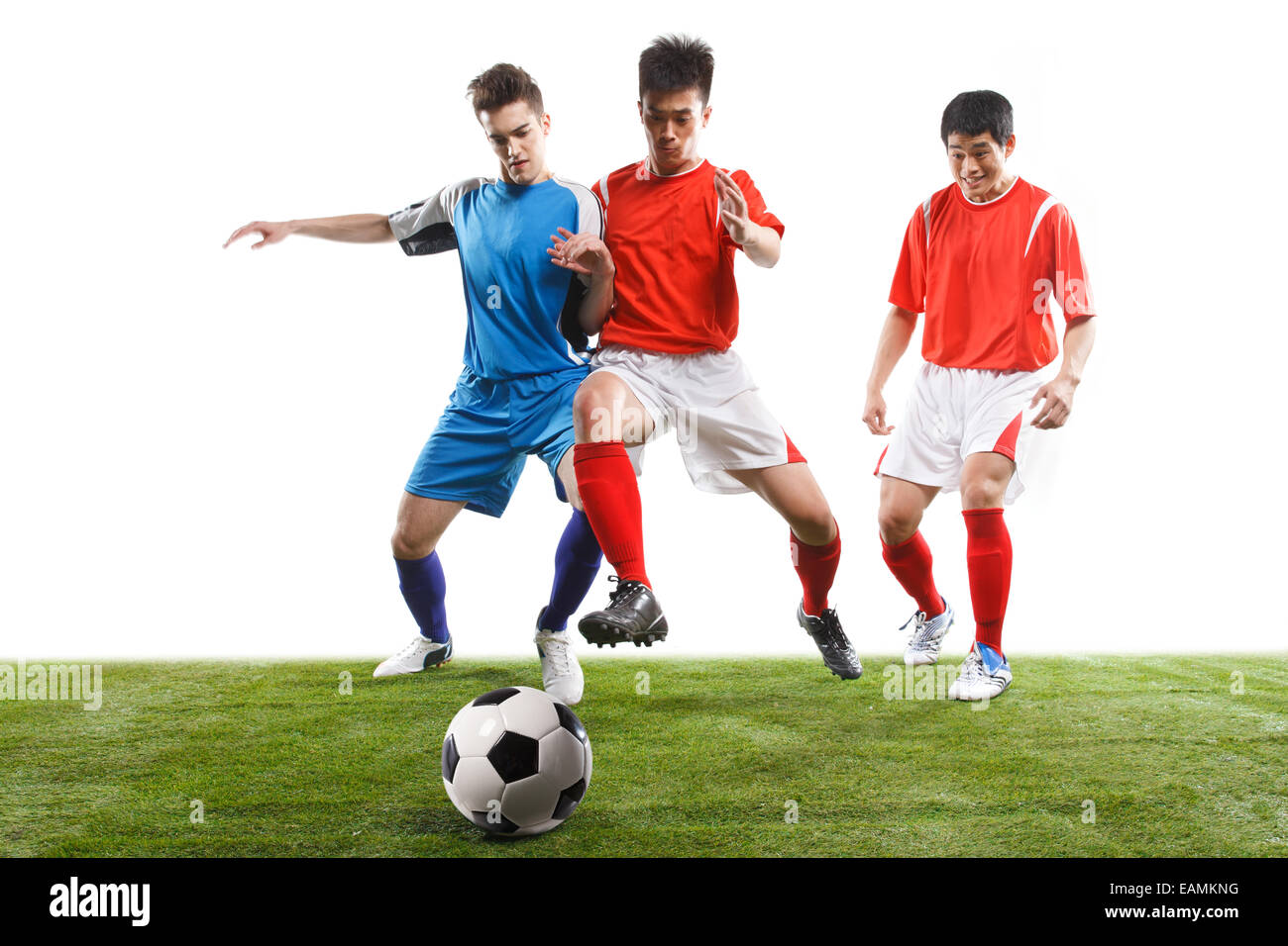 Three football players in football Stock Photo - Alamy