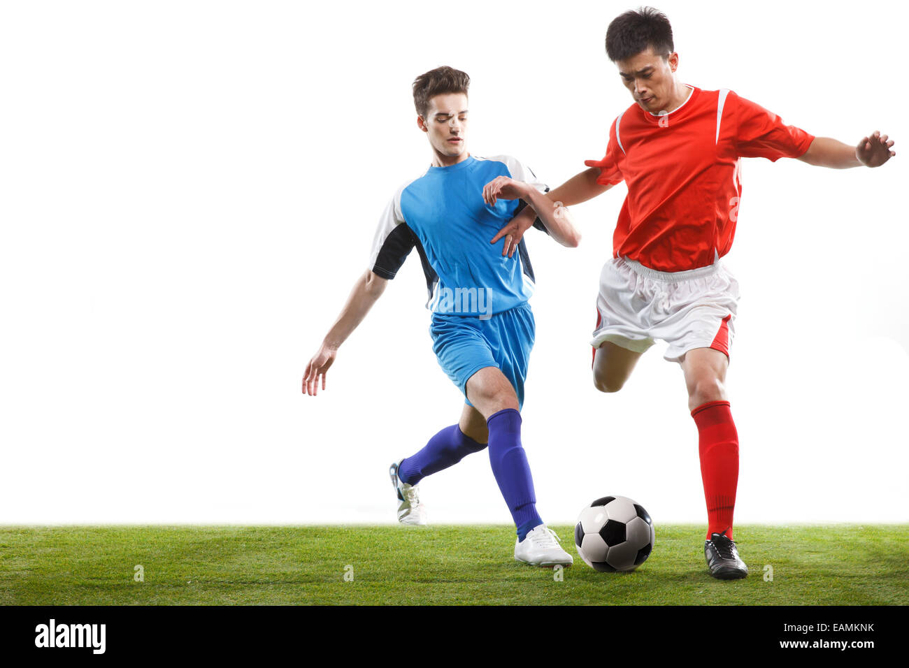 Two football players are playing football Stock Photo - Alamy