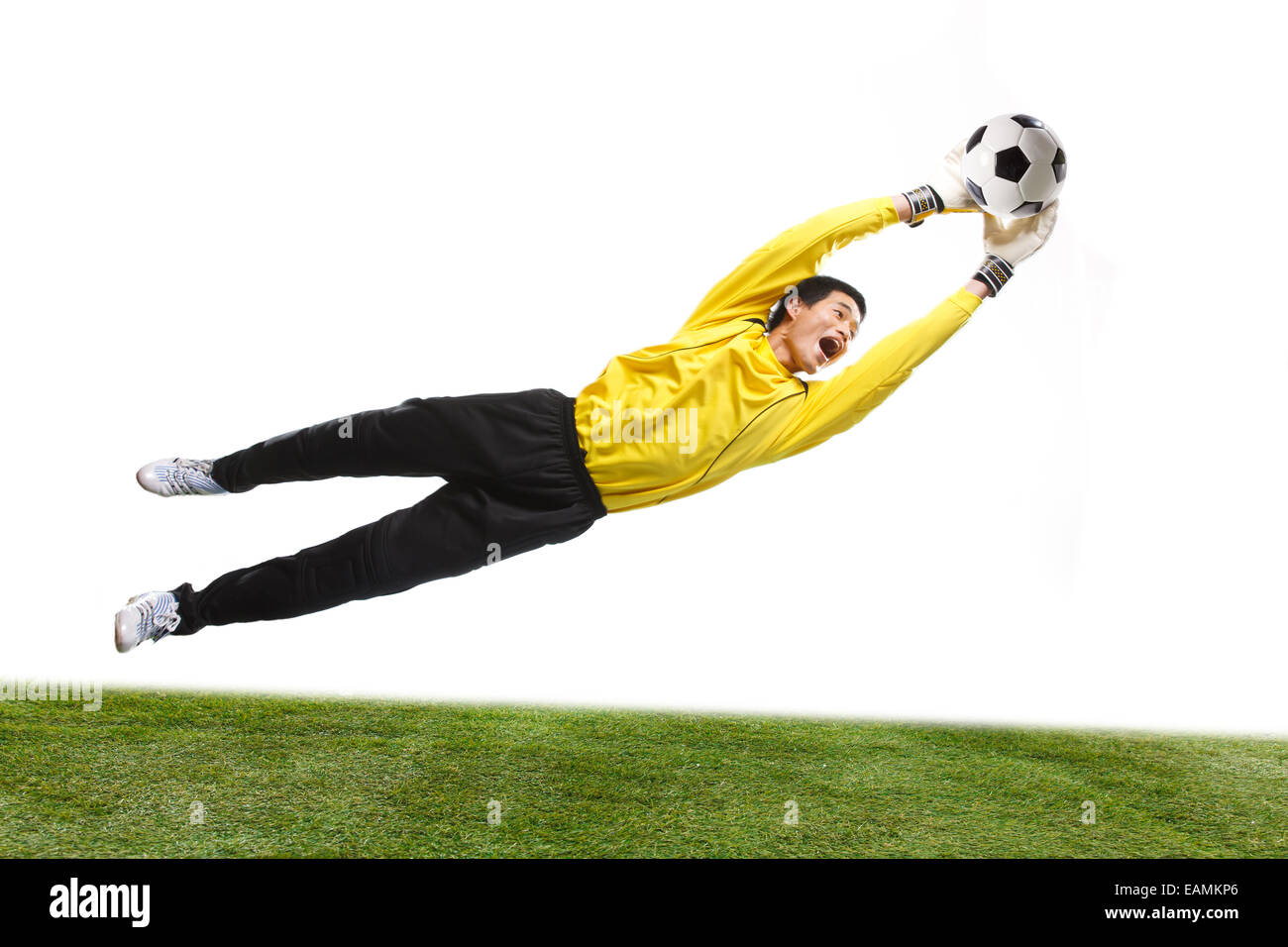 The goalkeeper to air to catch a ball Stock Photo - Alamy