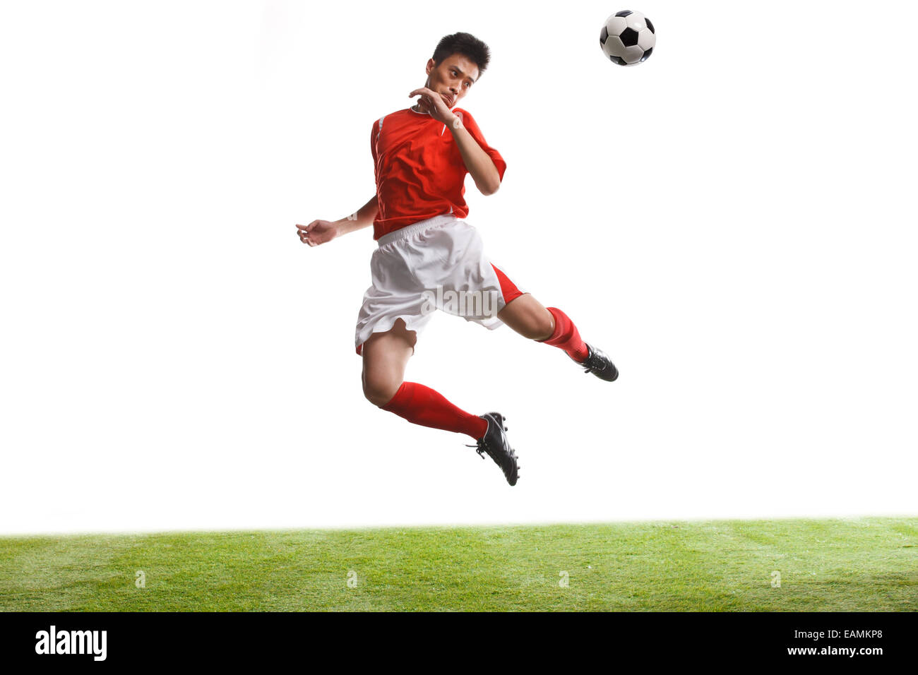 A football player is playing football Stock Photo - Alamy