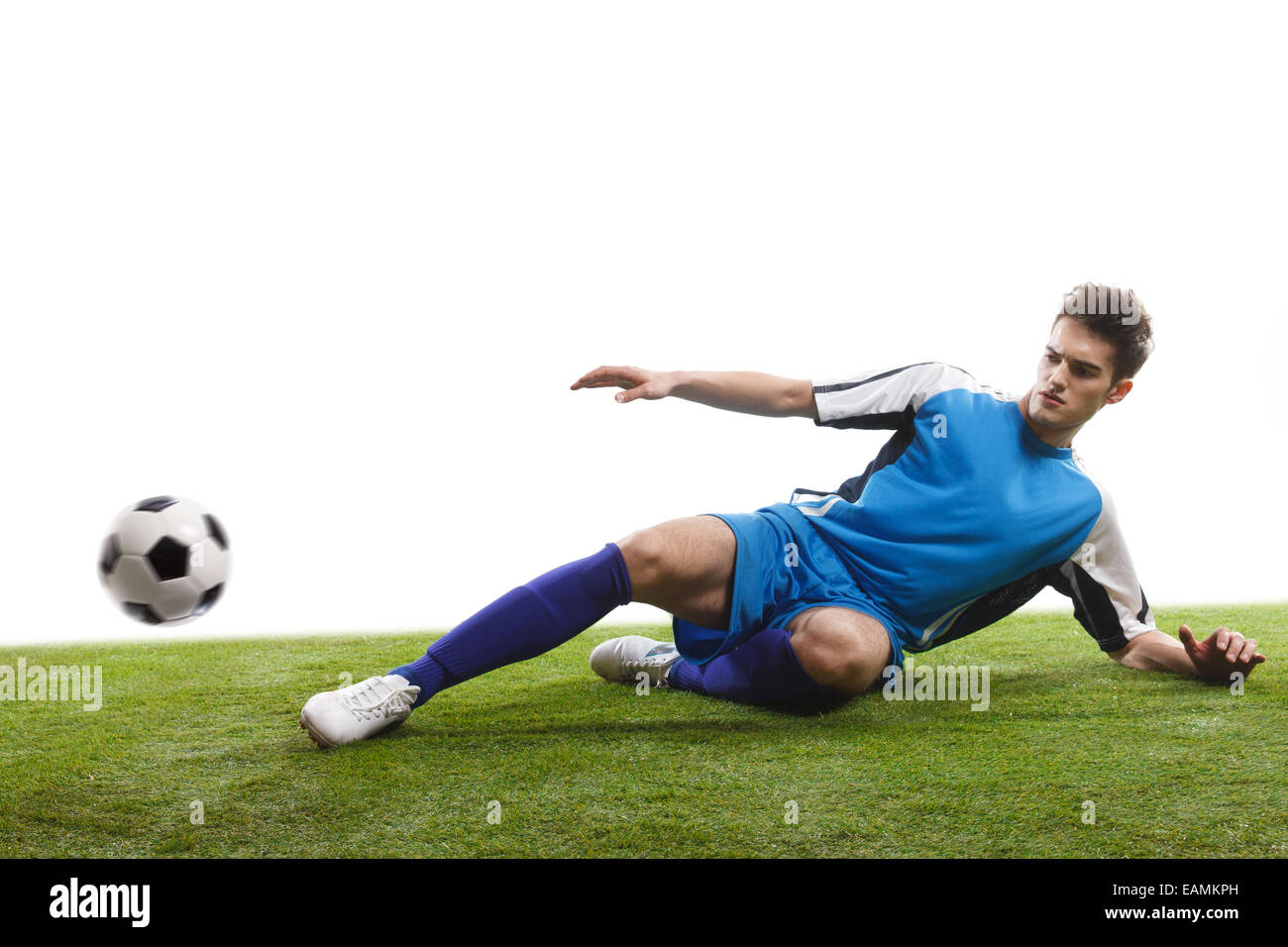 A football player is playing football Stock Photo - Alamy