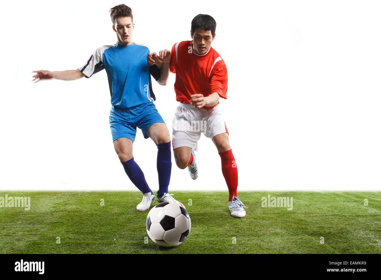 Two football players are playing football Stock Photo - Alamy