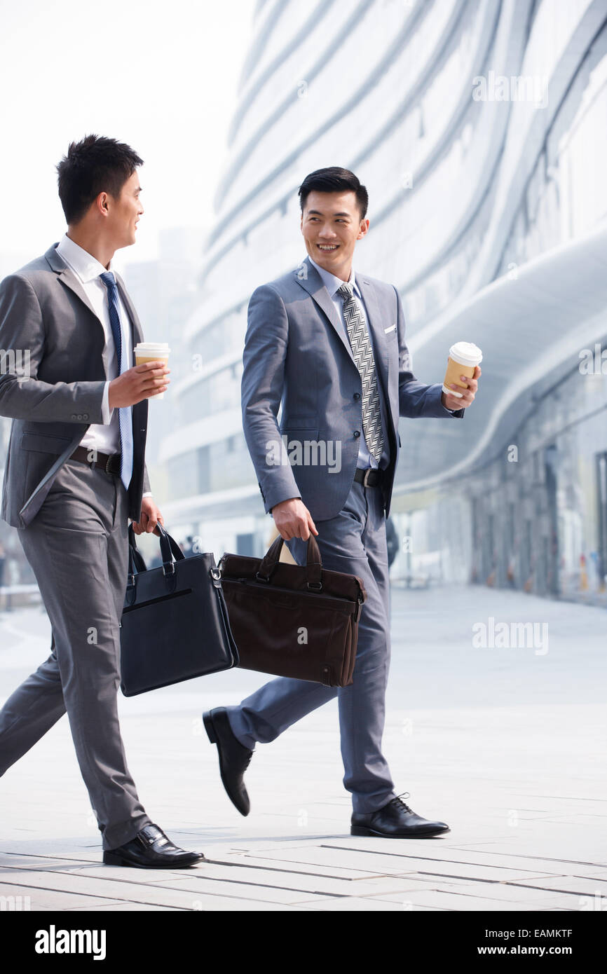 Two business men in a hurry to work Stock Photo - Alamy