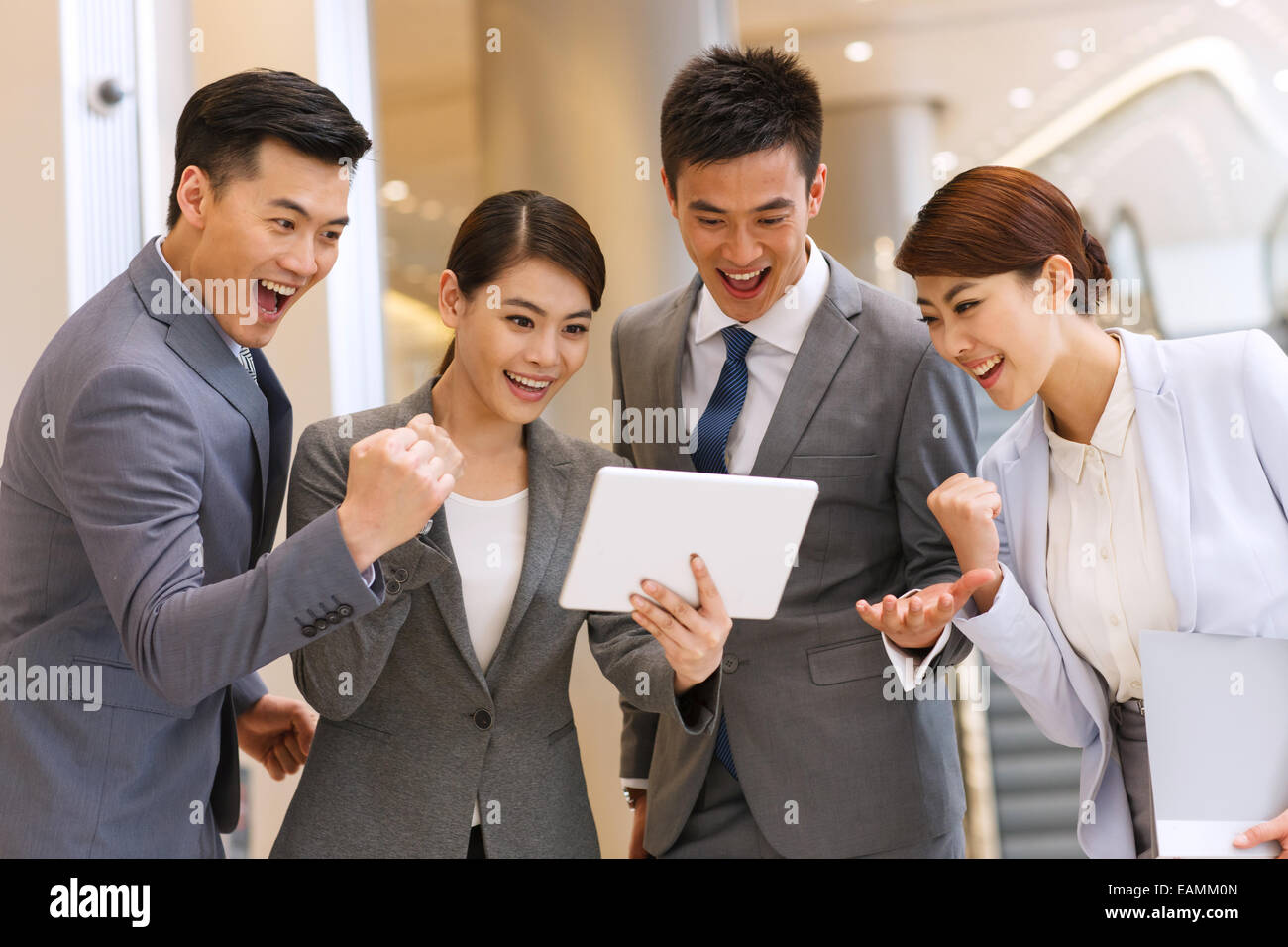 Four business people talk on the way from work Stock Photo - Alamy