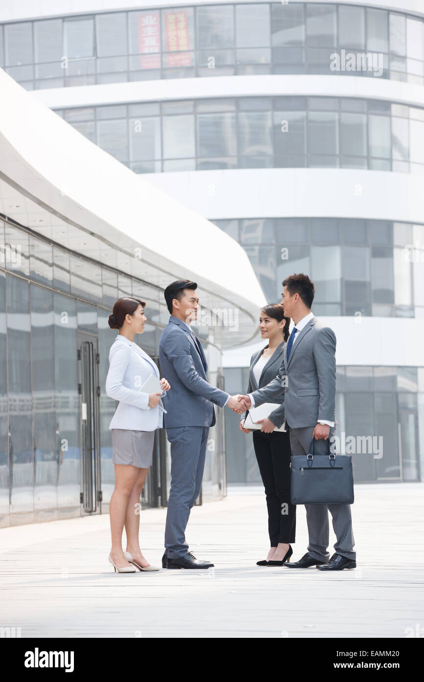 Four business people to meet Stock Photo - Alamy