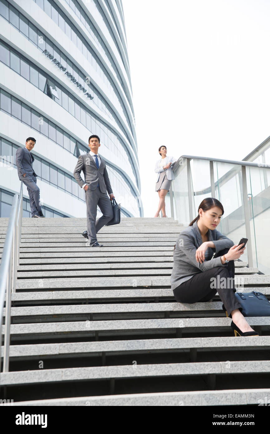 Business people sitting on steps hi-res stock photography and images ...