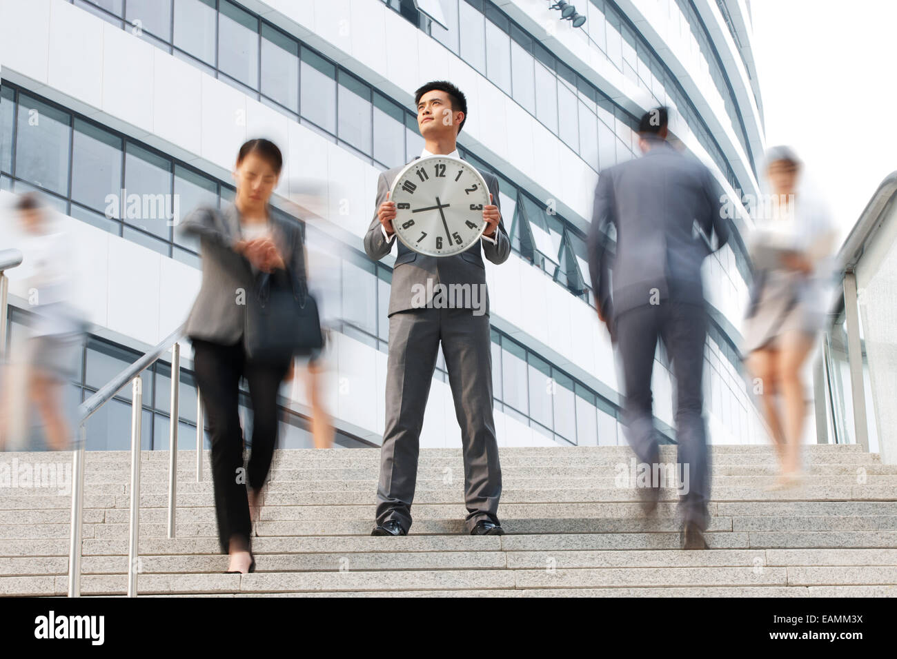 Eastern business people rush in a hurry Stock Photo - Alamy