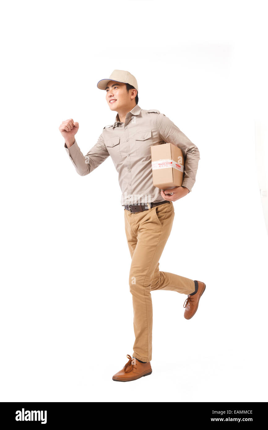 Oriental logistics personnel in a hurry to send mail Stock Photo - Alamy