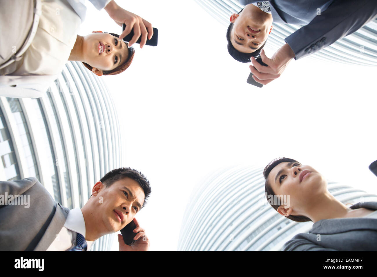 Eastern business people make a phone call Stock Photo - Alamy