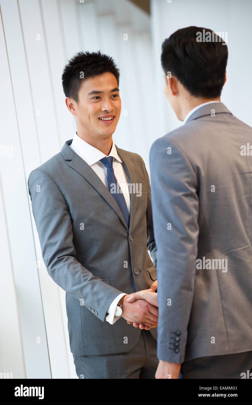 Two business men shake hands Stock Photo - Alamy