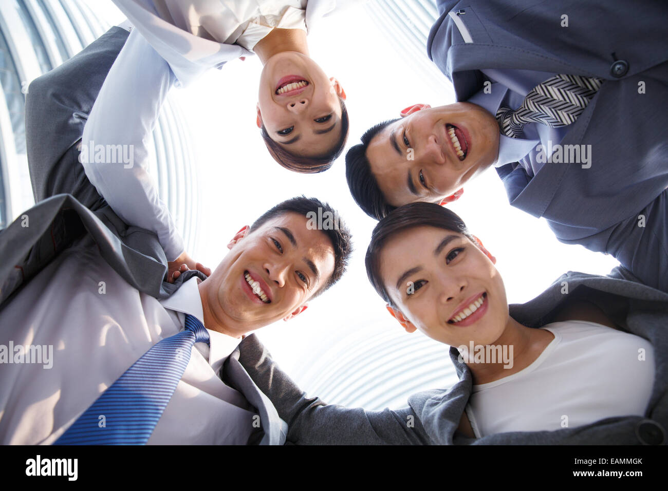 Four business people around the shoulders and head to head Stock Photo ...