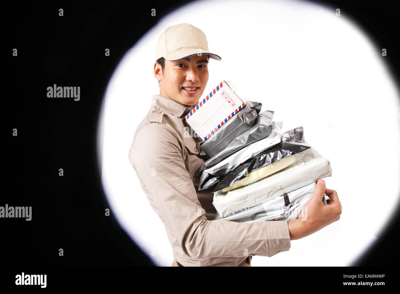Oriental logistics personnel hold mail Stock Photo - Alamy