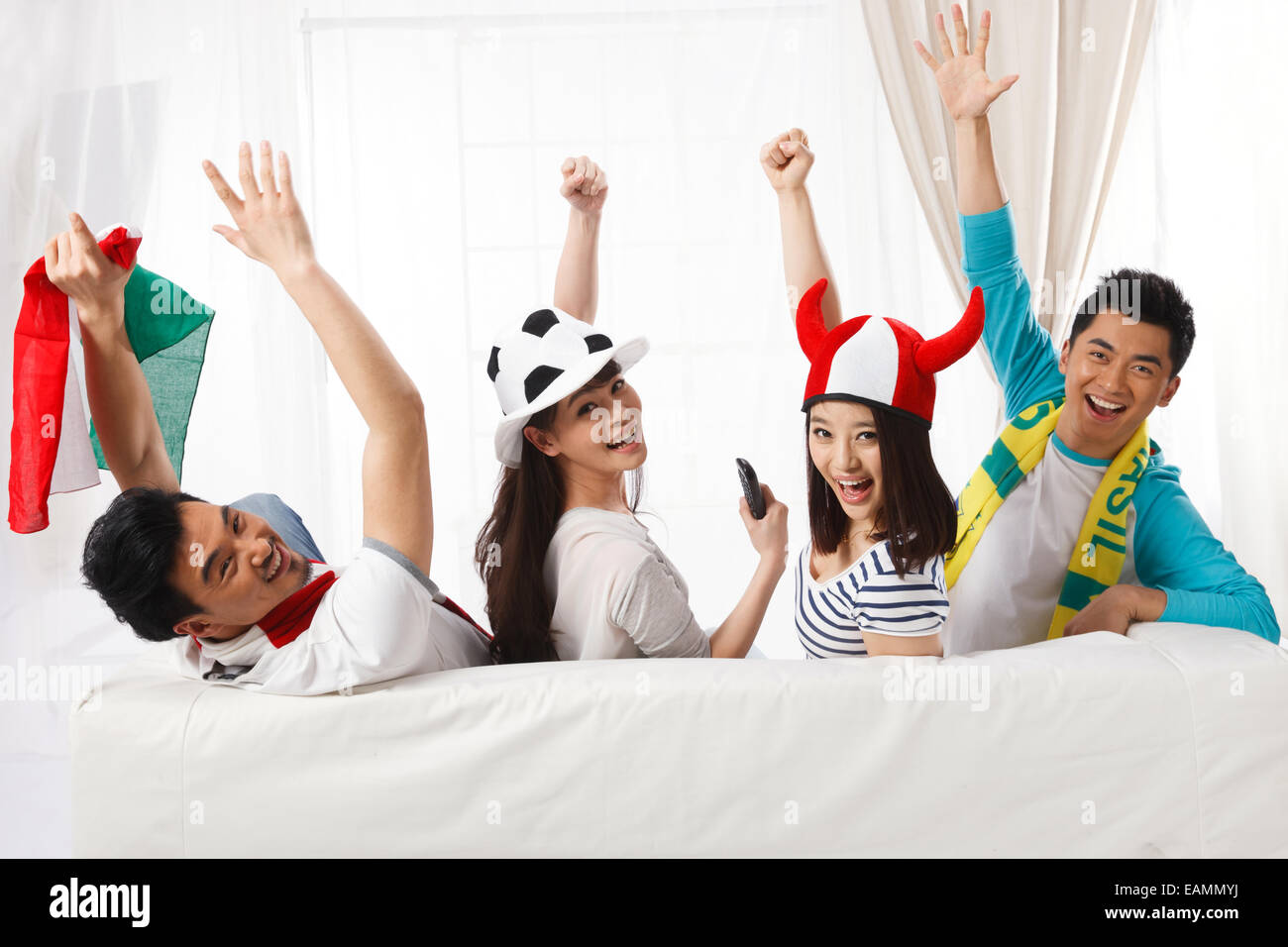 Young fans sat in a row Stock Photo - Alamy