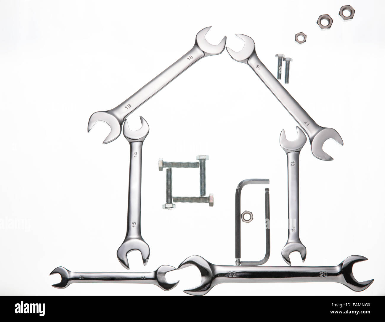 Using a wrench to construct houses Stock Photo - Alamy