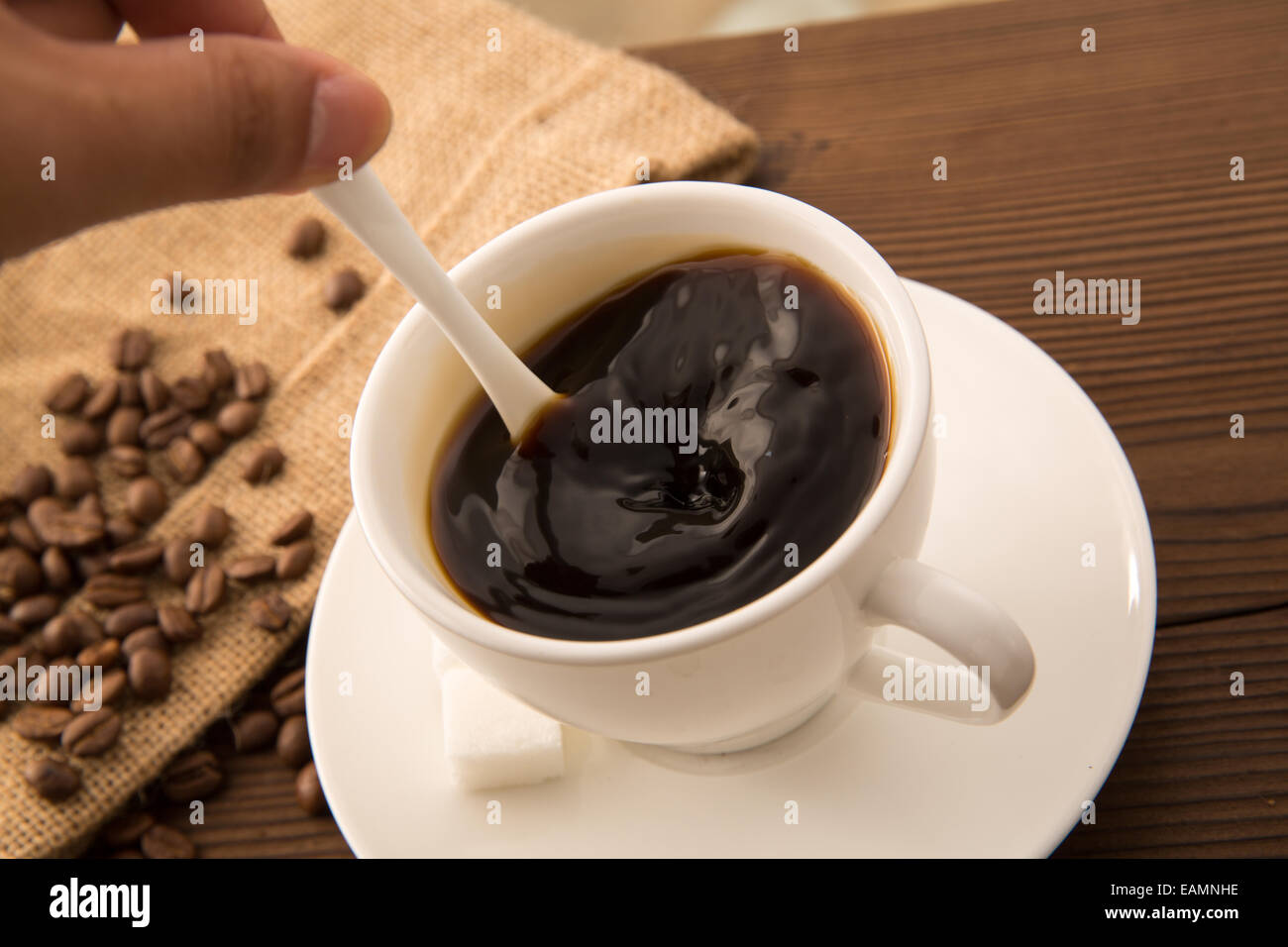 Hand stirring hot coffee hi-res stock photography and images - Alamy