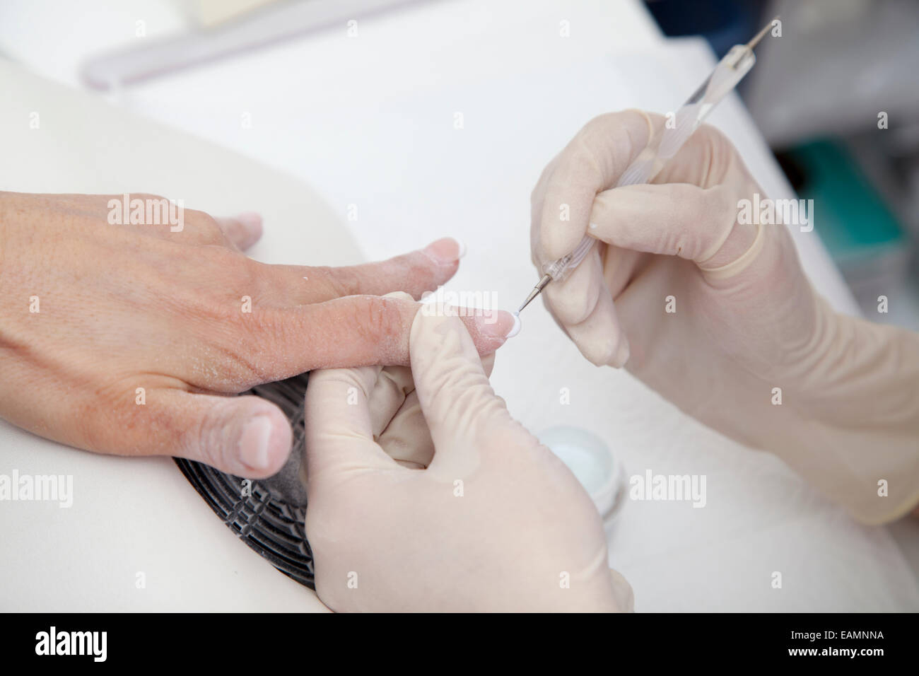 Manicure process on female hand, French manicure, Making nail extension ...