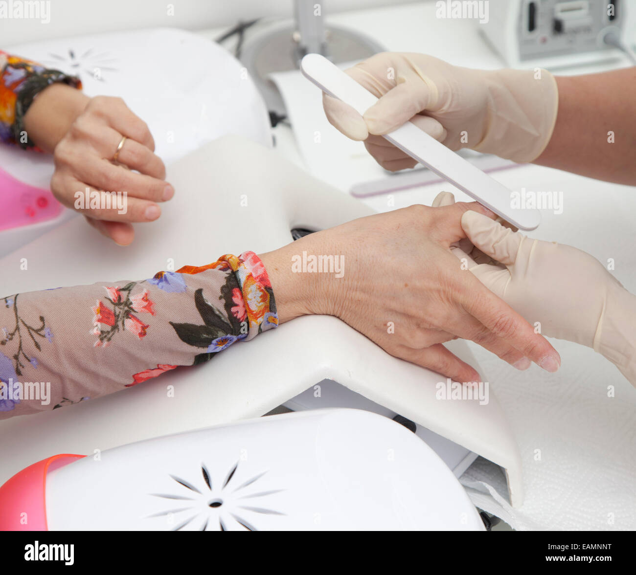 Manicure process on female hand, French manicure, Making nail extension ...