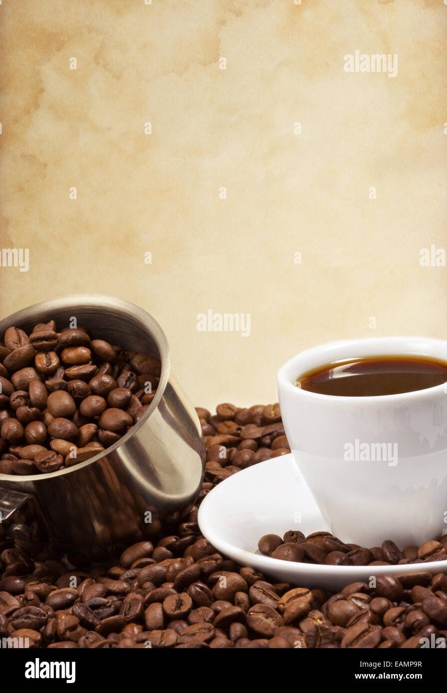 cup of coffee and pot full of beans Stock Photo - Alamy