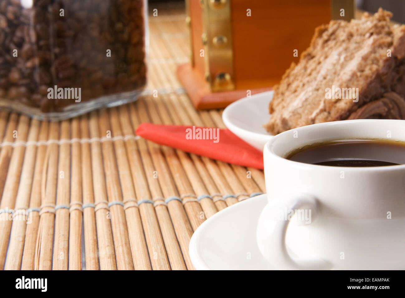 cup of coffee, pot, pie and wood grinder on straw material Stock Photo ...