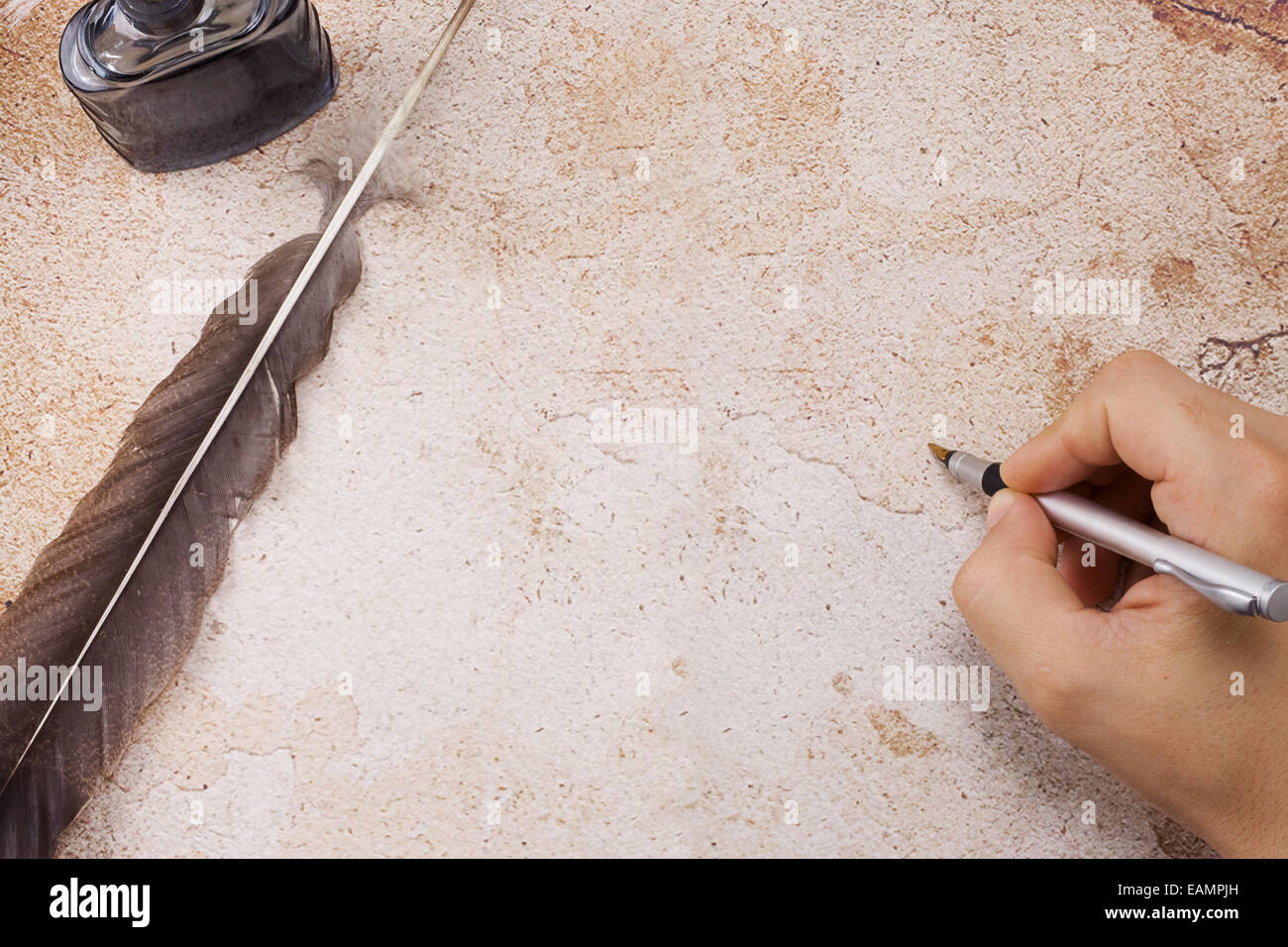 Hand holding feather writing hi-res stock photography and images - Alamy