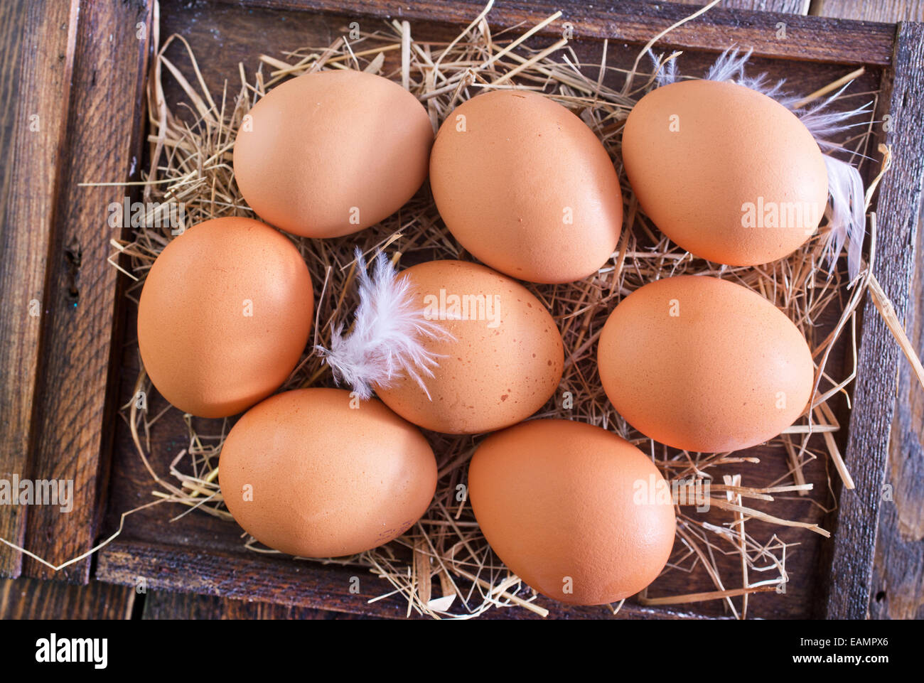 raw chicken eggs with brown shells on the table Stock Photo - Alamy