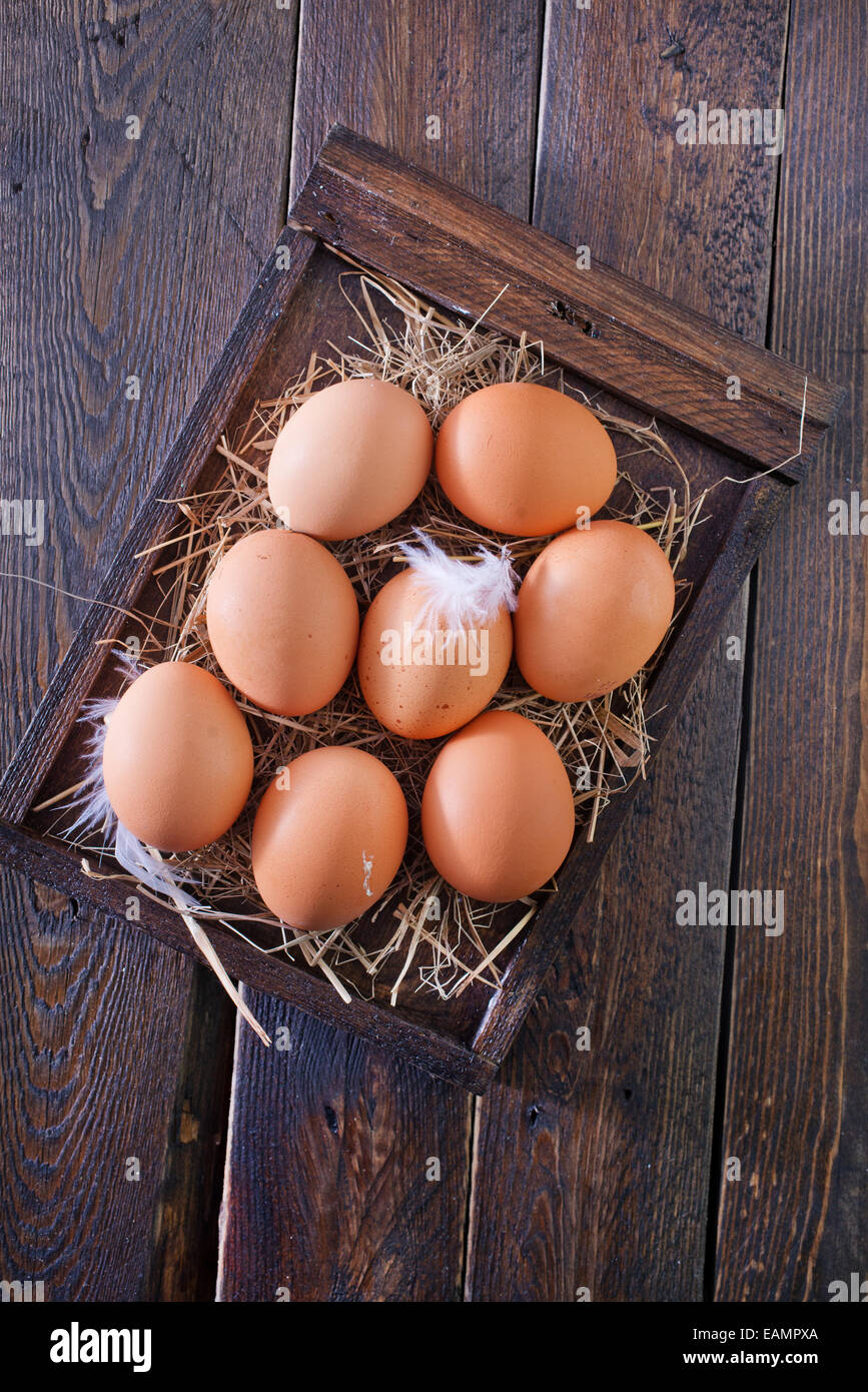 raw chicken eggs with brown shells on the table Stock Photo - Alamy