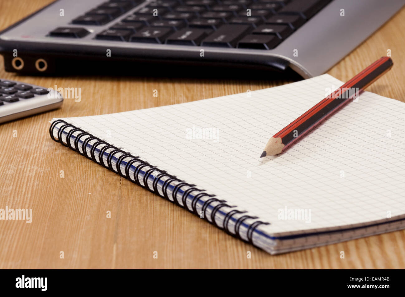 computer keyboard and notebook on wood table Stock Photo - Alamy